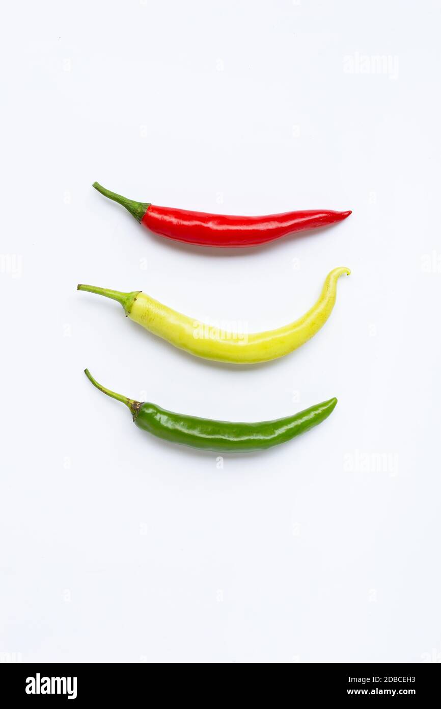 Different colors chili peppers isolated on white background Stock Photo ...