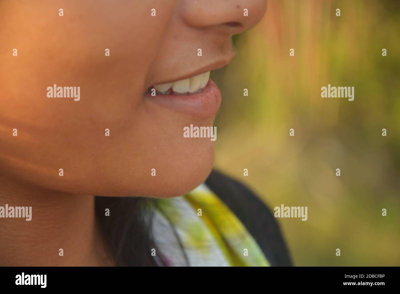 Close up of the teeth of a teenage girl with smile on her face ...