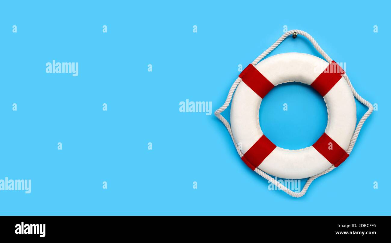 Red white lifebuoy on blue background. Copy space Stock Photo - Alamy