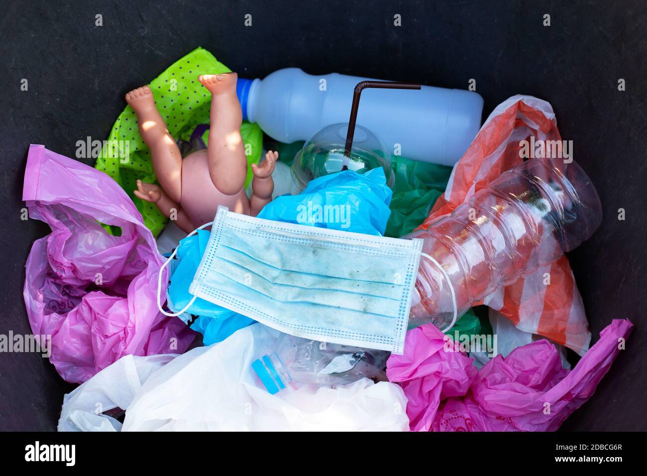 Dirty used surgical mask in a garbage bin Stock Photo - Alamy