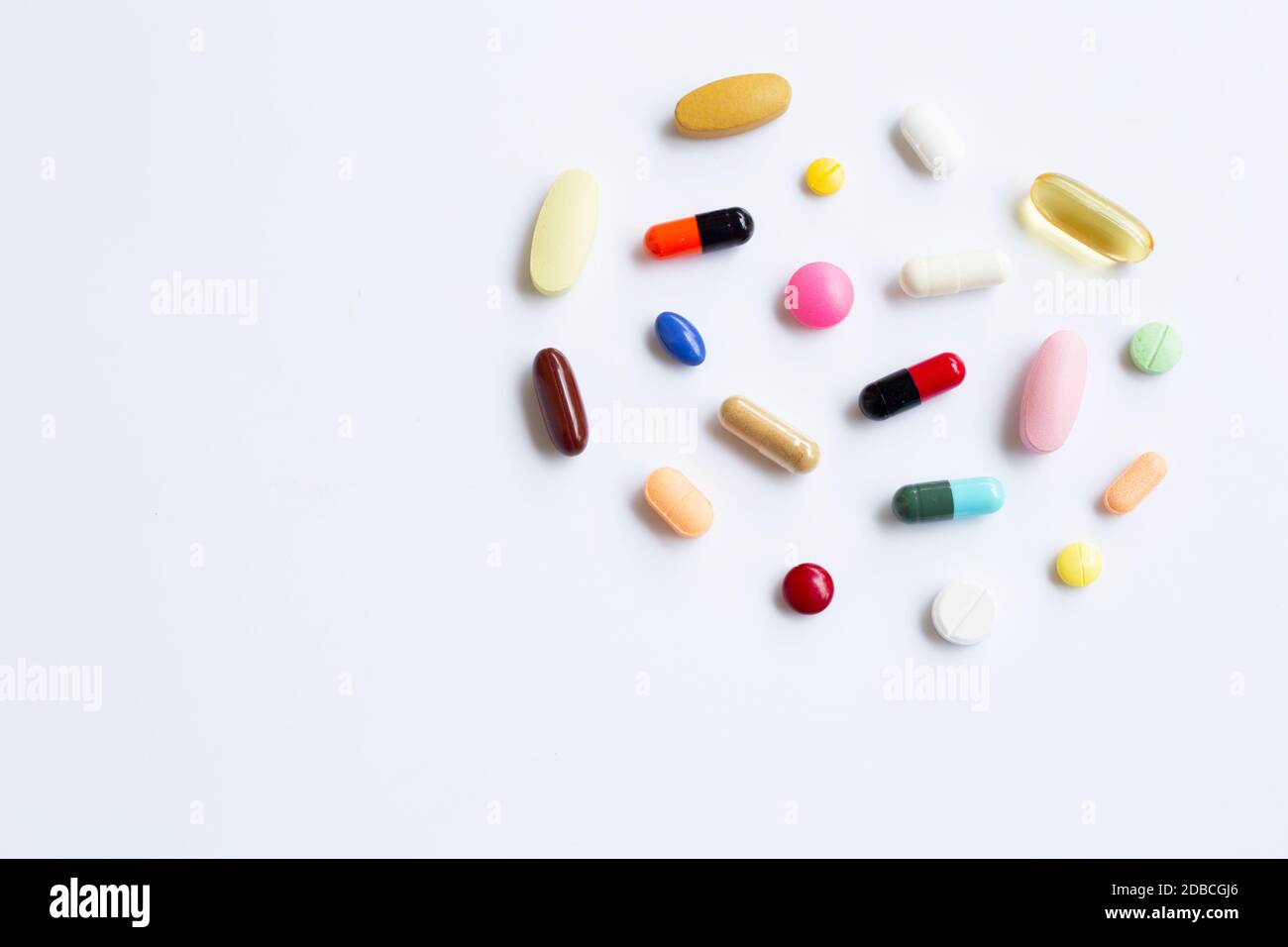 Colorful tablets with capsules and pills on white background Stock ...