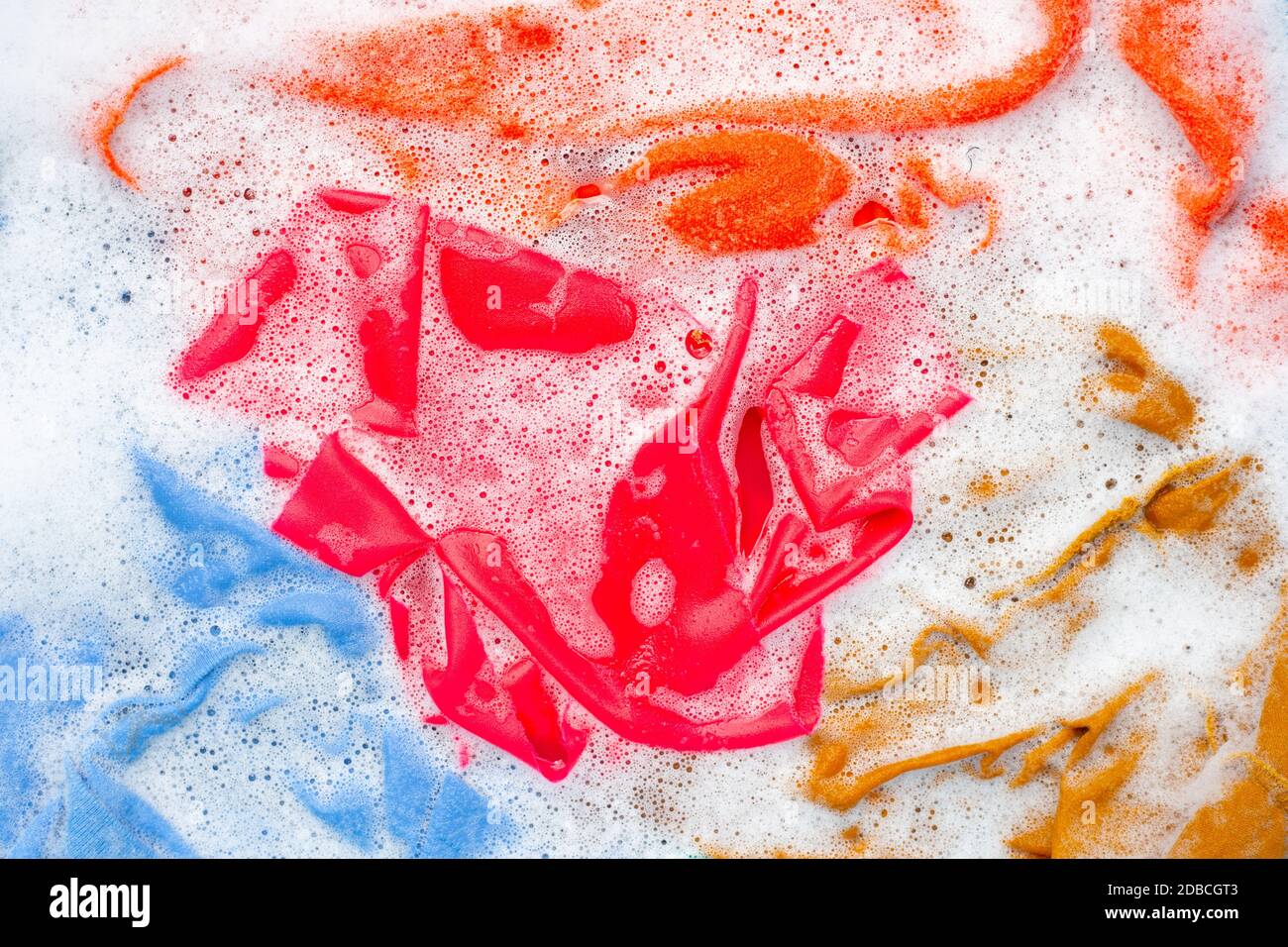 Color clothes soak before washing. Top view Stock Photo - Alamy