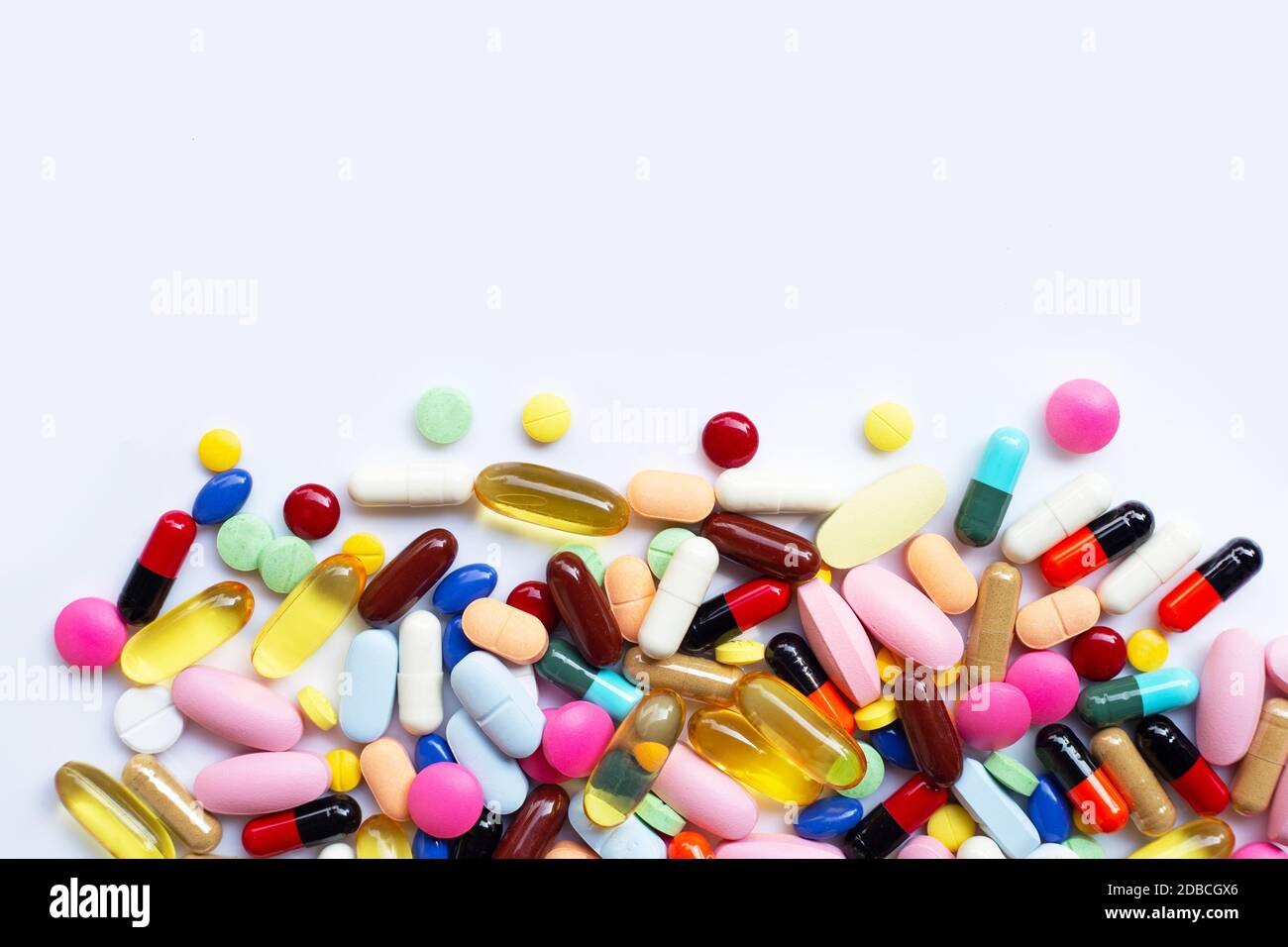 Colorful tablets with capsules and pills on white background Stock ...
