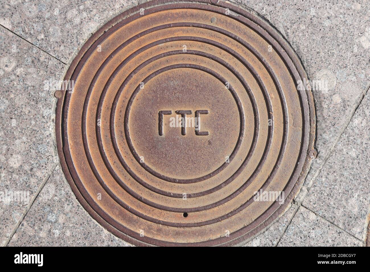 Metal hatch on the road. Rusted manhole Stock Photo - Alamy
