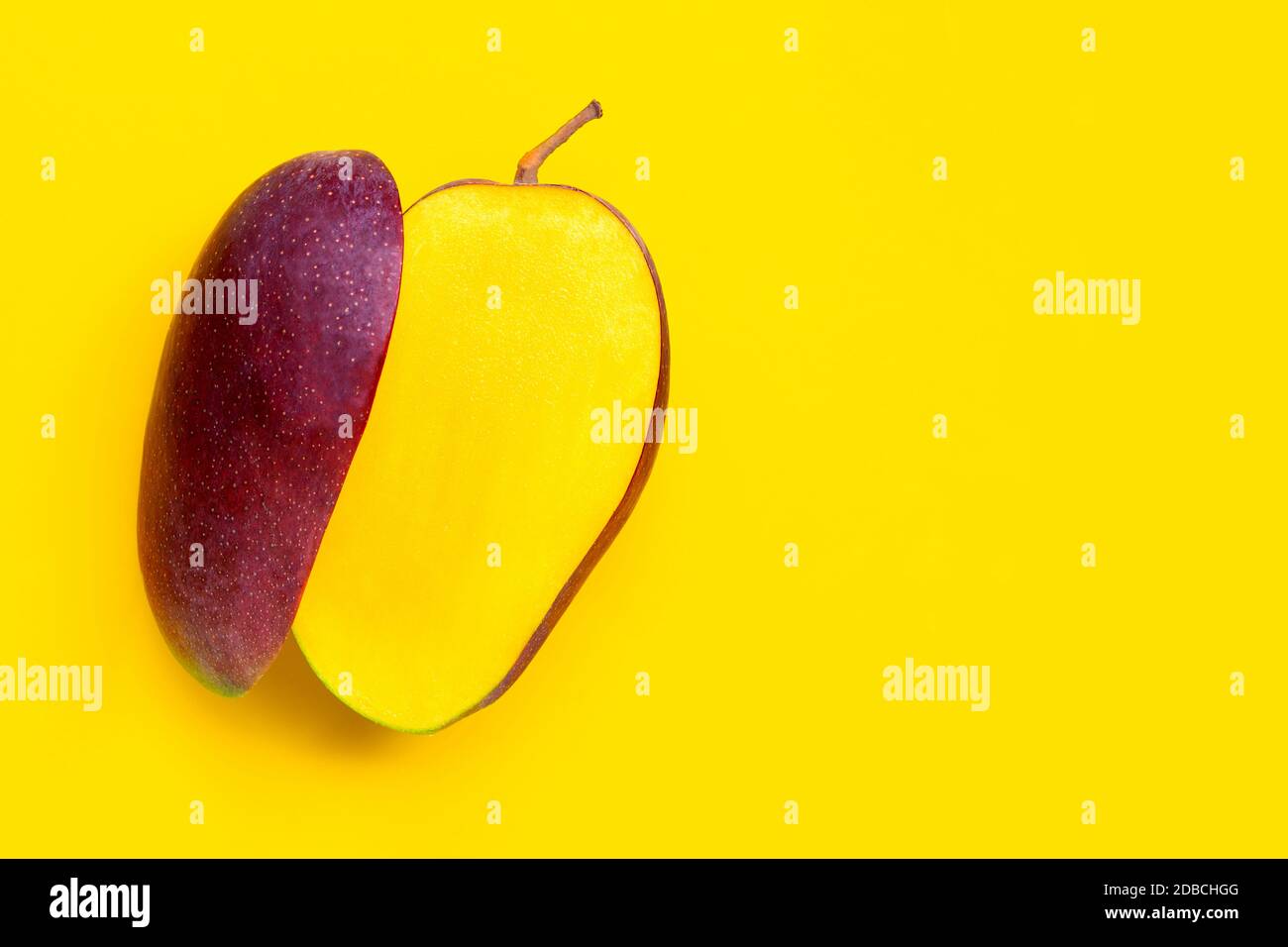 Tropical fruit, Mango on yellow background. Copy space Stock Photo - Alamy