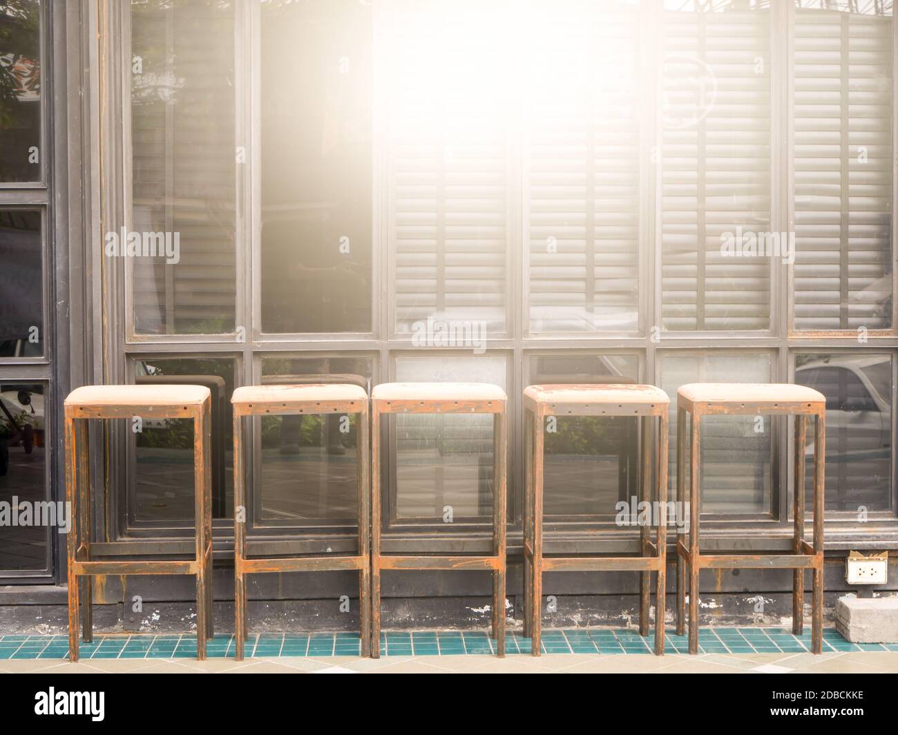 Cafe with brick cafe and bar interior , row of chairs near glass ...