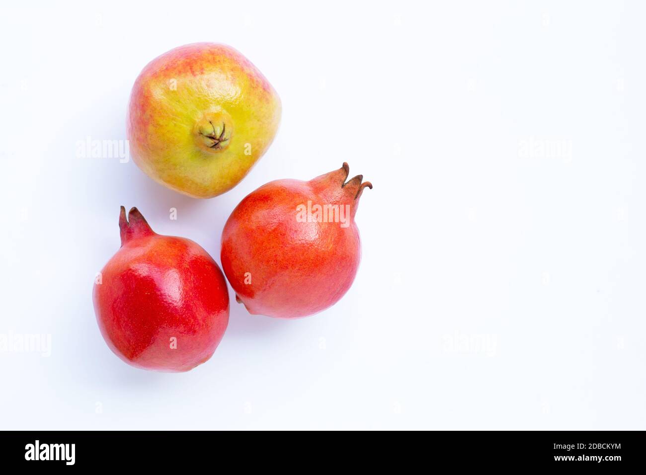 Top view of ripe pomegranate fruit on white background Stock Photo - Alamy