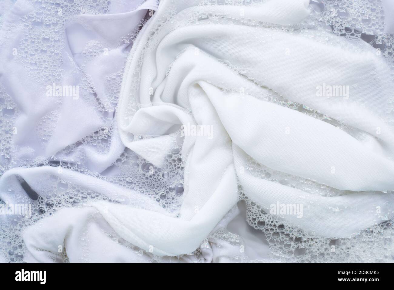Soak white clothes in powder detergent water dissolution. Laundry ...