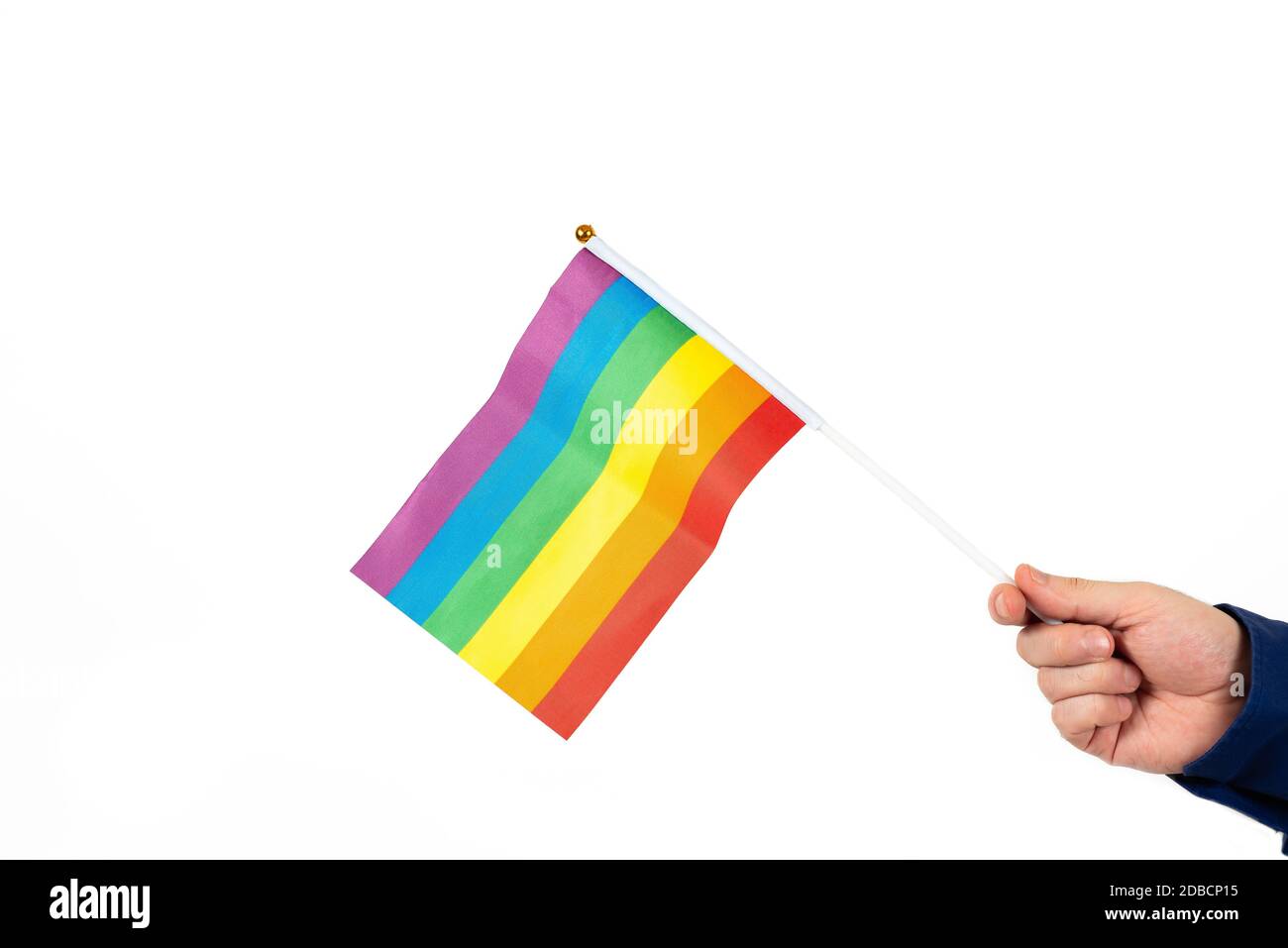 Male hand holding a rainbow flag isolated on white background Stock ...