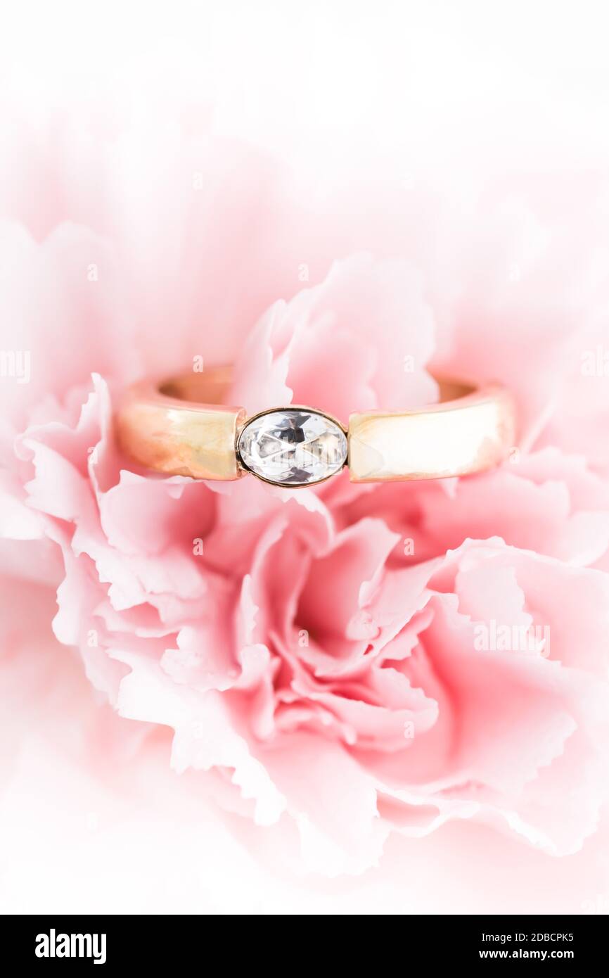 Wedding or engagement ring in a flower. Symbol of love. Soft focus ...