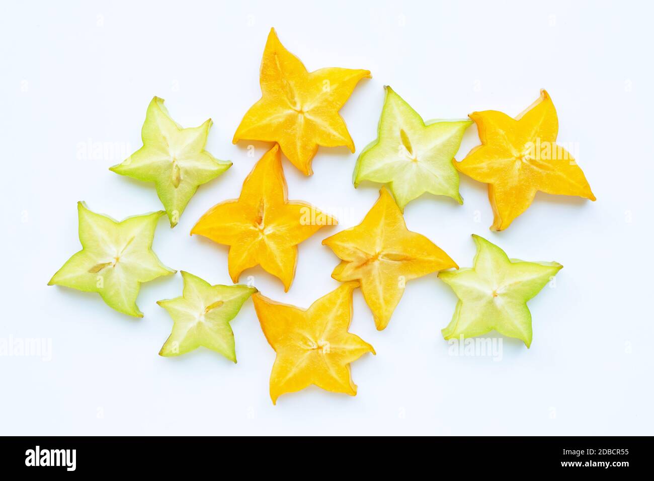Green and yellow sliced ripe star fruit on white background Stock Photo ...