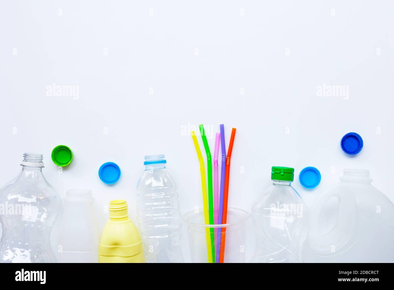 Plastic waste on white background. Copy space Stock Photo - Alamy