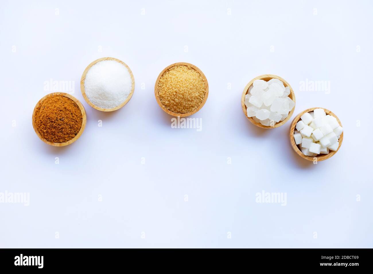 Various types of sugar on white background Stock Photo - Alamy
