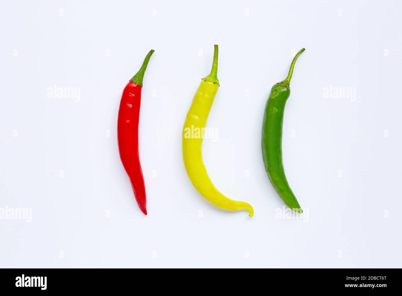 Different colors chili peppers isolated on white background Stock Photo ...