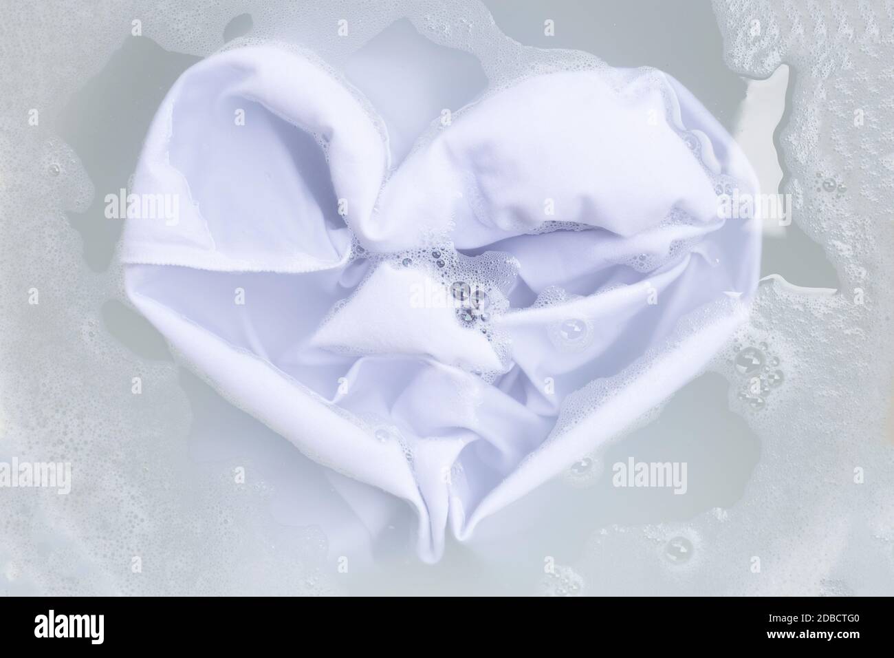 Soak a cloth before washing, white cloth. Top view Stock Photo - Alamy