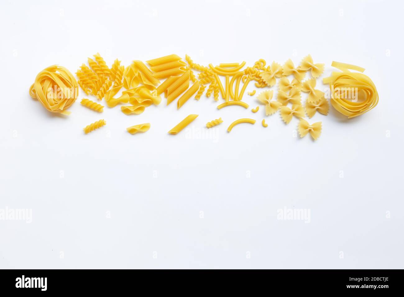 Different types of dry pasta on white background Stock Photo - Alamy