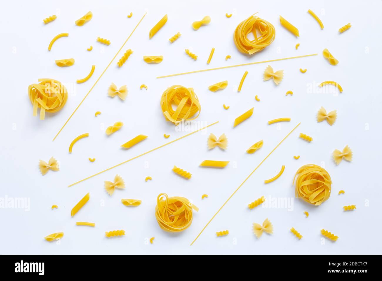 Different types of dry pasta on white background Stock Photo - Alamy