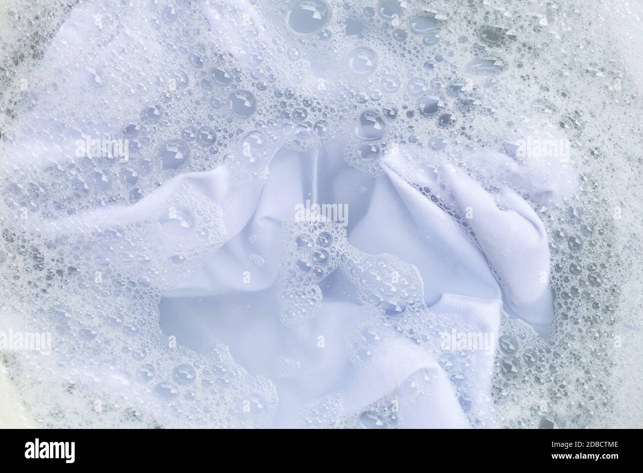 Soak a cloth before washing, white cloth. Top view Stock Photo - Alamy
