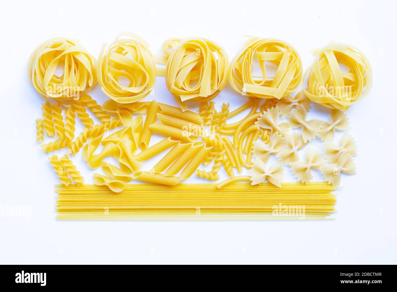 Different types of dry pasta on white background Stock Photo - Alamy