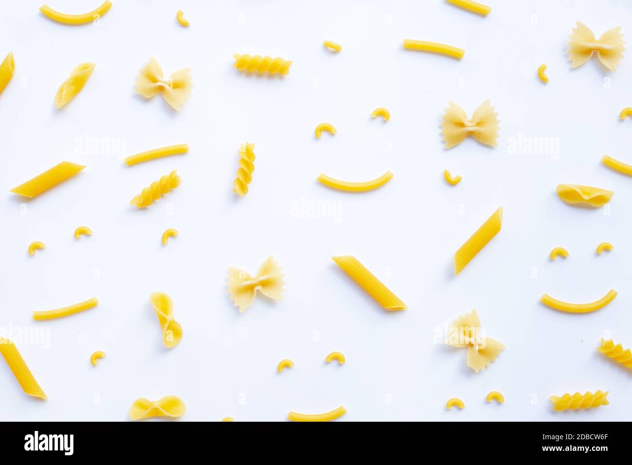 Different types of dry pasta on white background Stock Photo - Alamy
