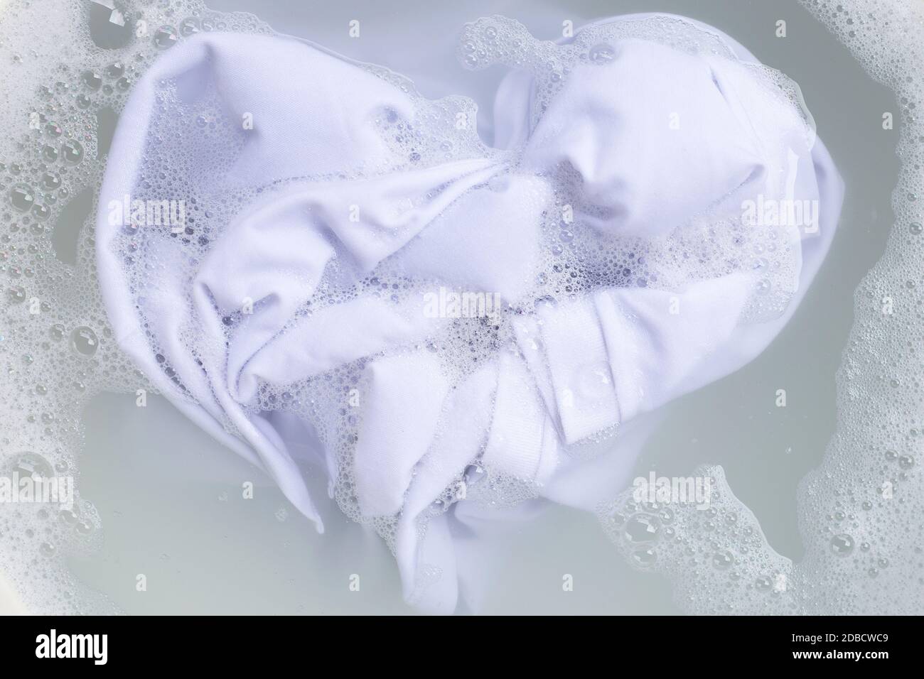 Soak a cloth before washing, white cloth. Top view Stock Photo - Alamy