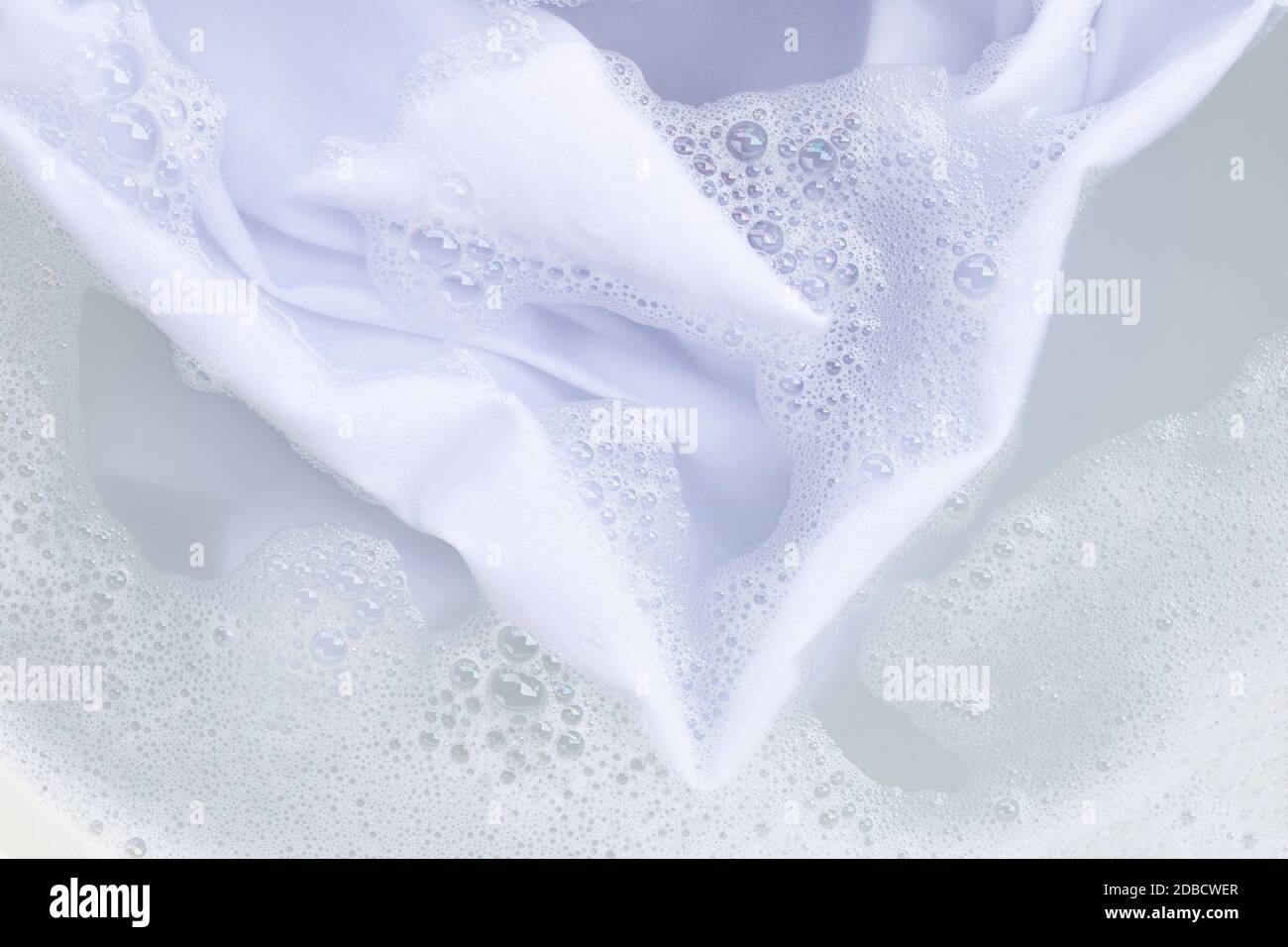 Soak a cloth before washing, white cloth. Top view Stock Photo - Alamy
