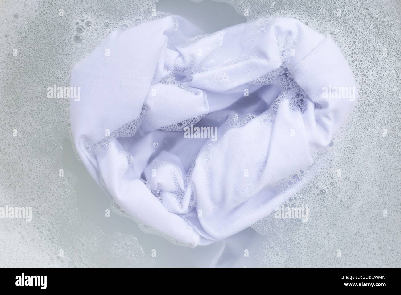 Soak a cloth before washing, white cloth. Top view Stock Photo - Alamy