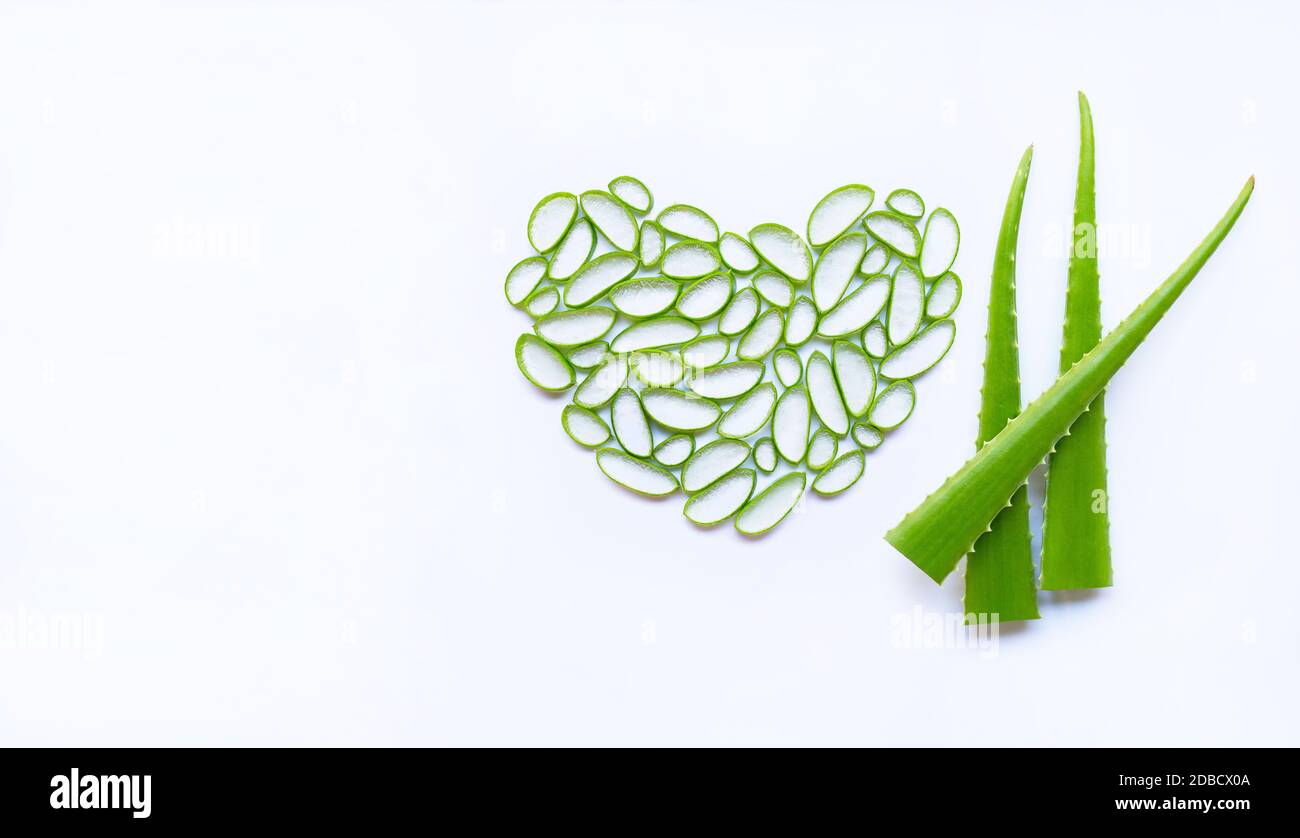 Aloe vera slices heart shape and aloe vera leaves on white background ...