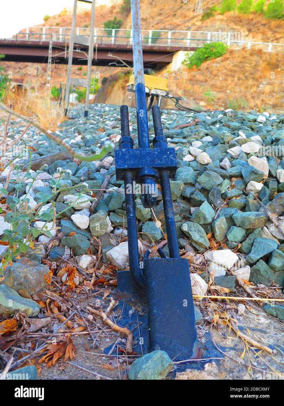 Imbedded steel wire support for railway overhead line gantry near Alora ...