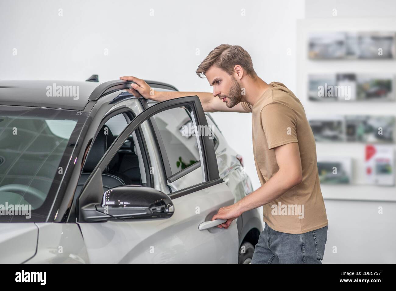 Man opening car door hi-res stock photography and images - Alamy