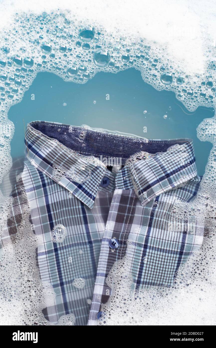 Shirt soak in powder detergent water dissolution, washing cloth ...