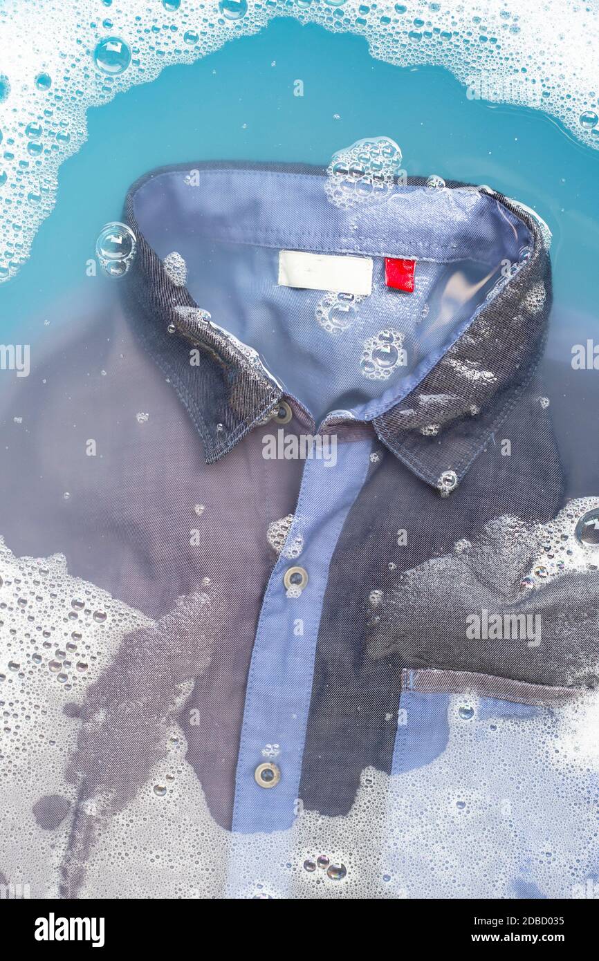 Shirt soak in powder detergent water dissolution, washing cloth ...