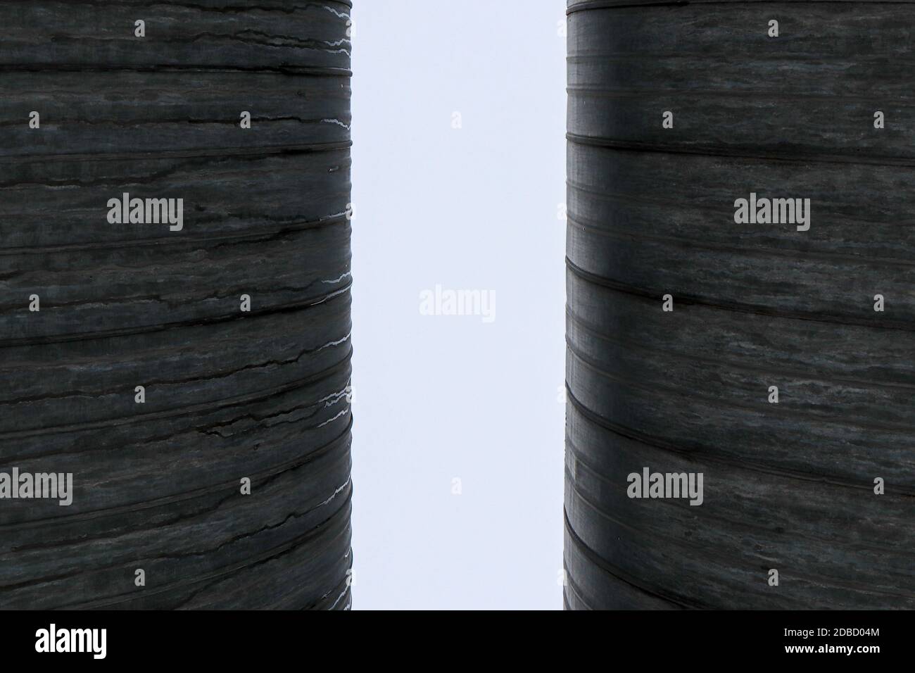 Two metal pipes with clearance background Stock Photo - Alamy