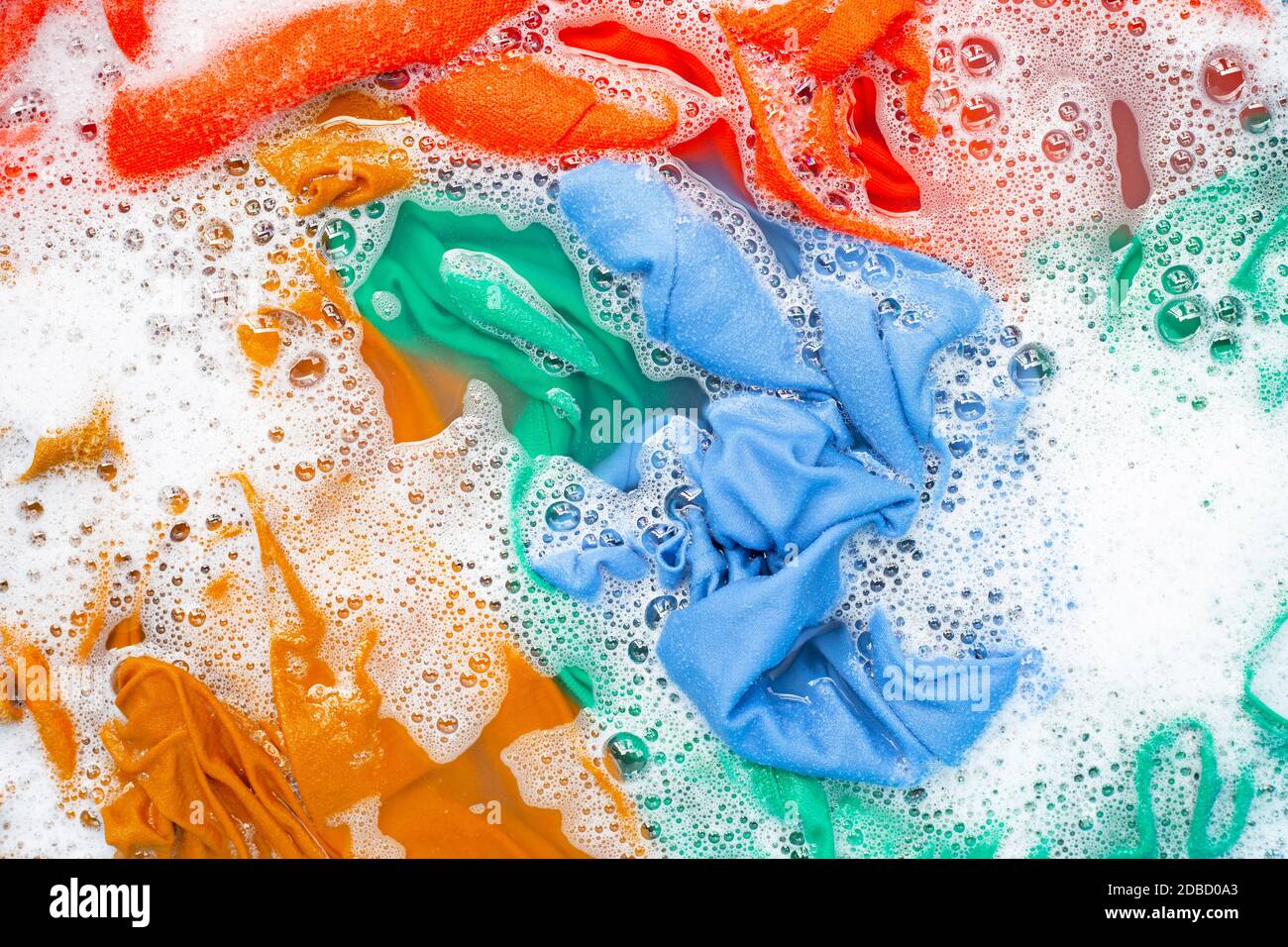 Color clothes soak before washing. Top view Stock Photo - Alamy