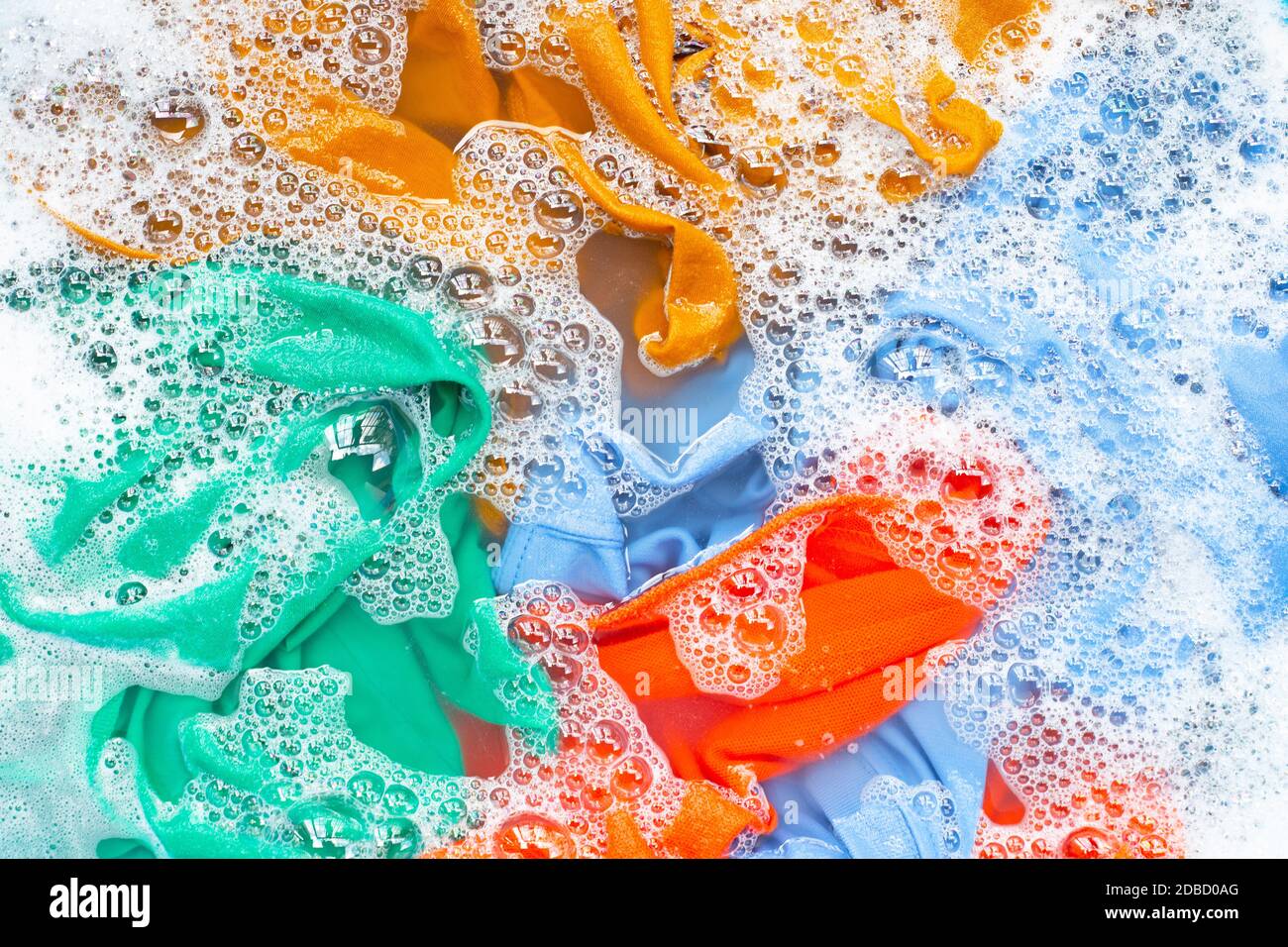 Color clothes soak before washing. Top view Stock Photo - Alamy