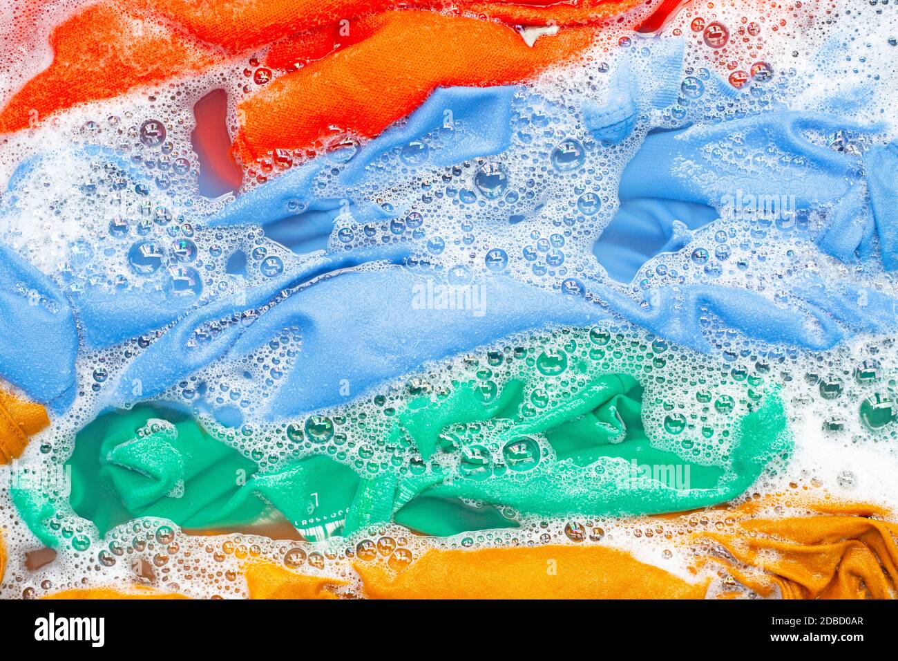 Color clothes soak before washing. Top view Stock Photo - Alamy