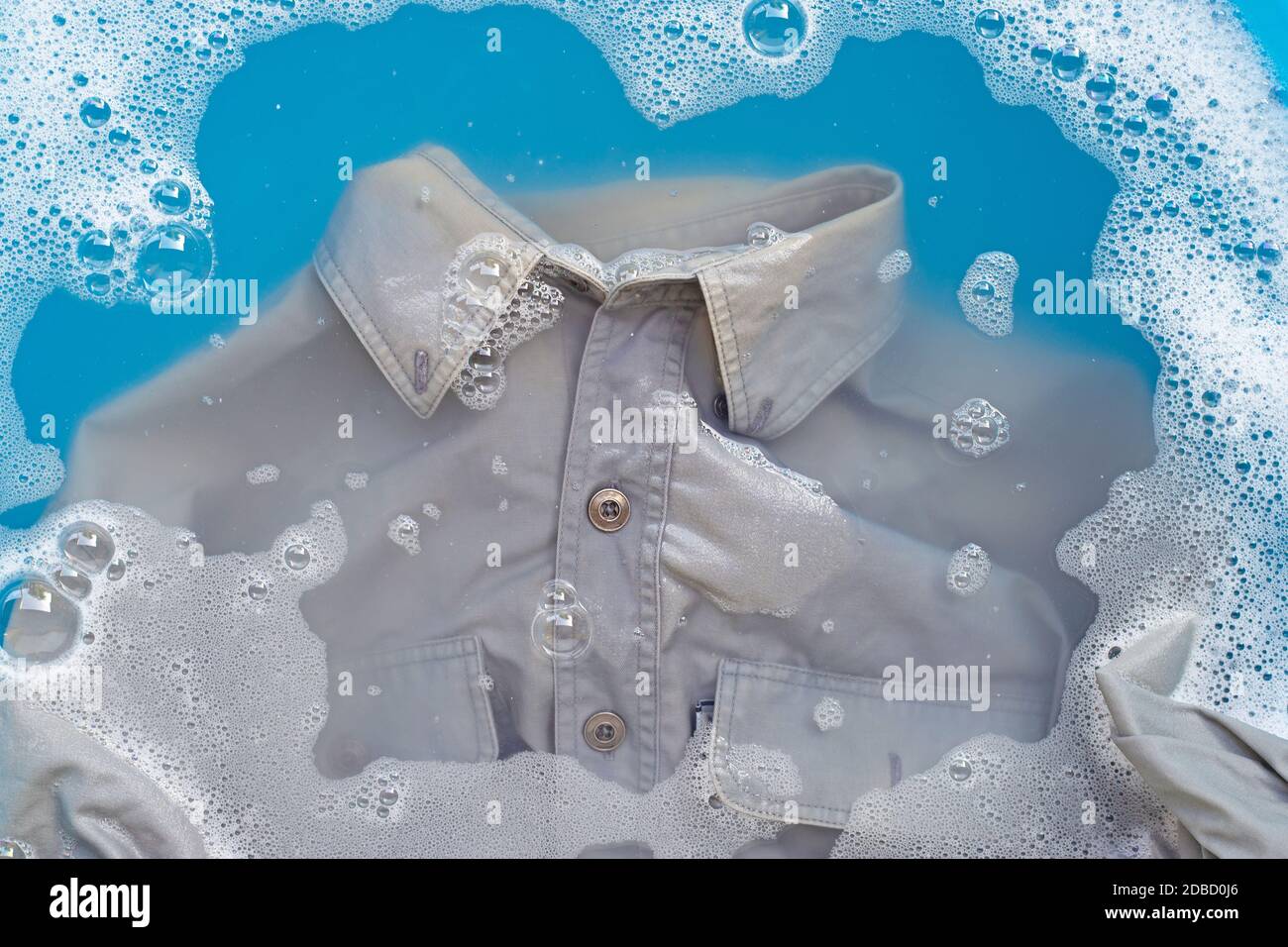 Shirt soak in powder detergent water dissolution, washing cloth ...