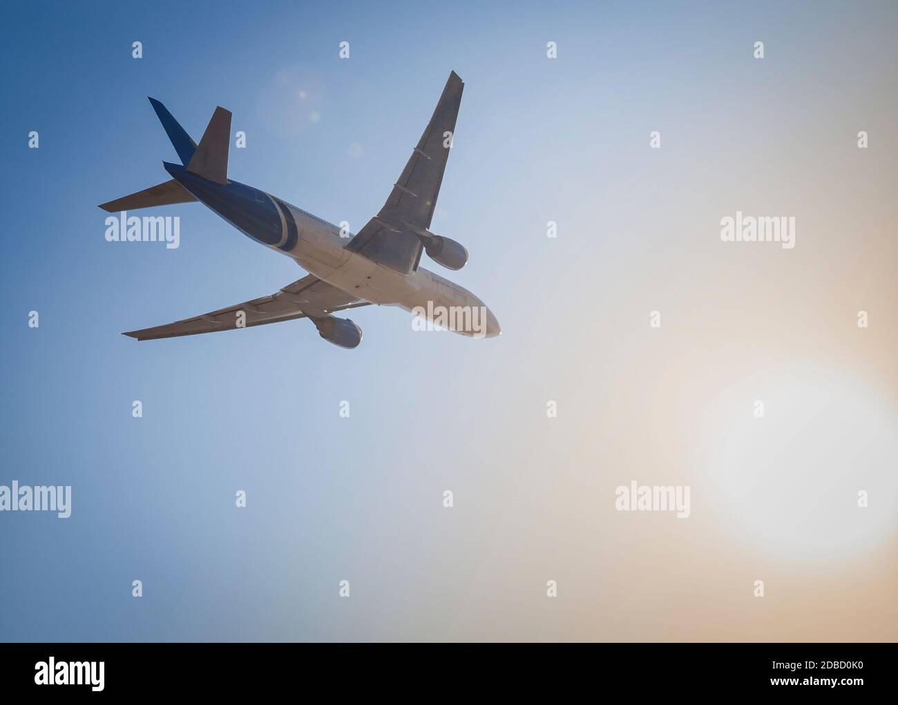 White plane flies in the sky. Bottom view. Takeoff and landing. Arrival ...