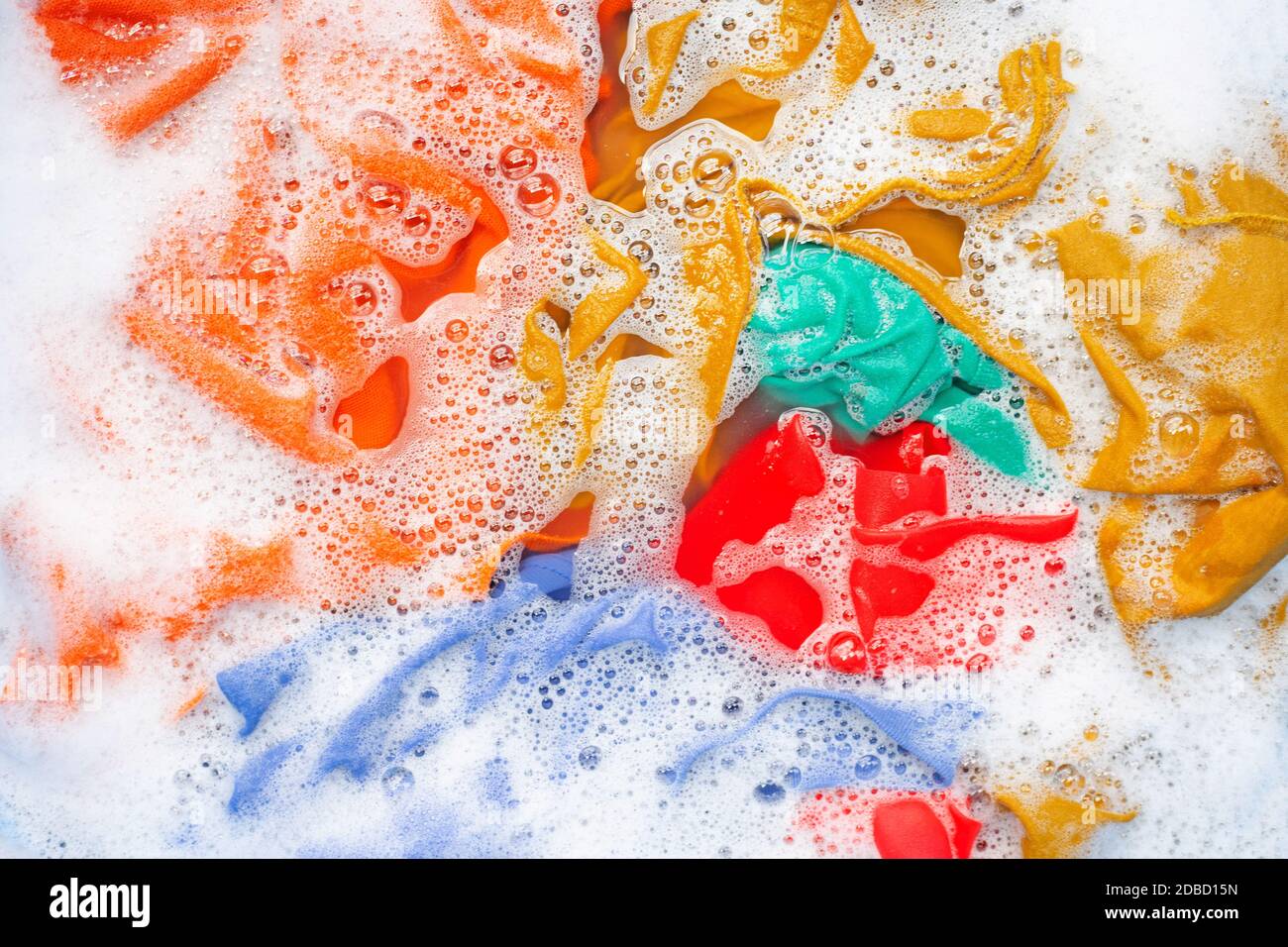 Color clothes soak before washing. Top view Stock Photo - Alamy