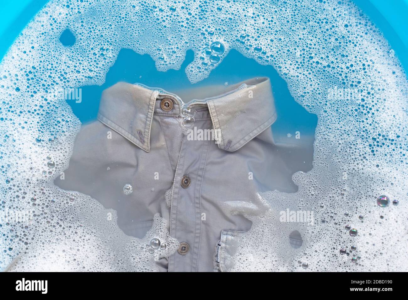 Shirt soak in powder detergent water dissolution, washing cloth ...