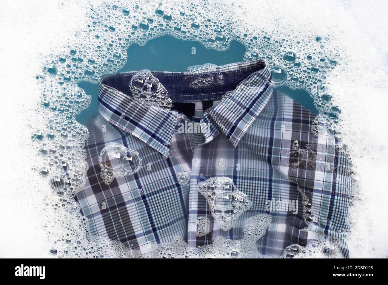 Shirt soak in powder detergent water dissolution, washing cloth ...