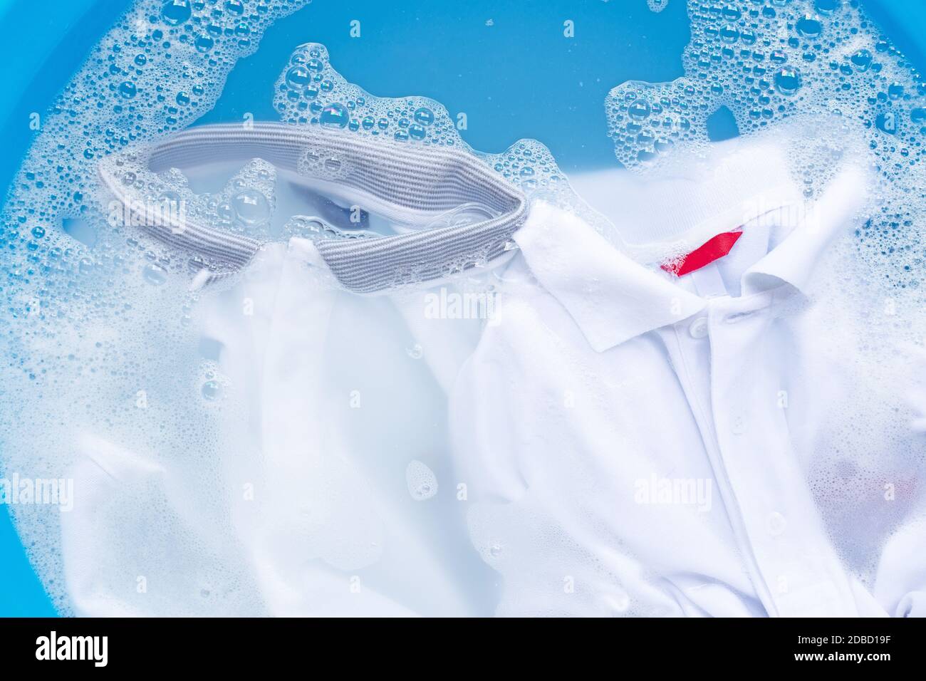 Shirt soak in powder detergent water dissolution, washing cloth ...