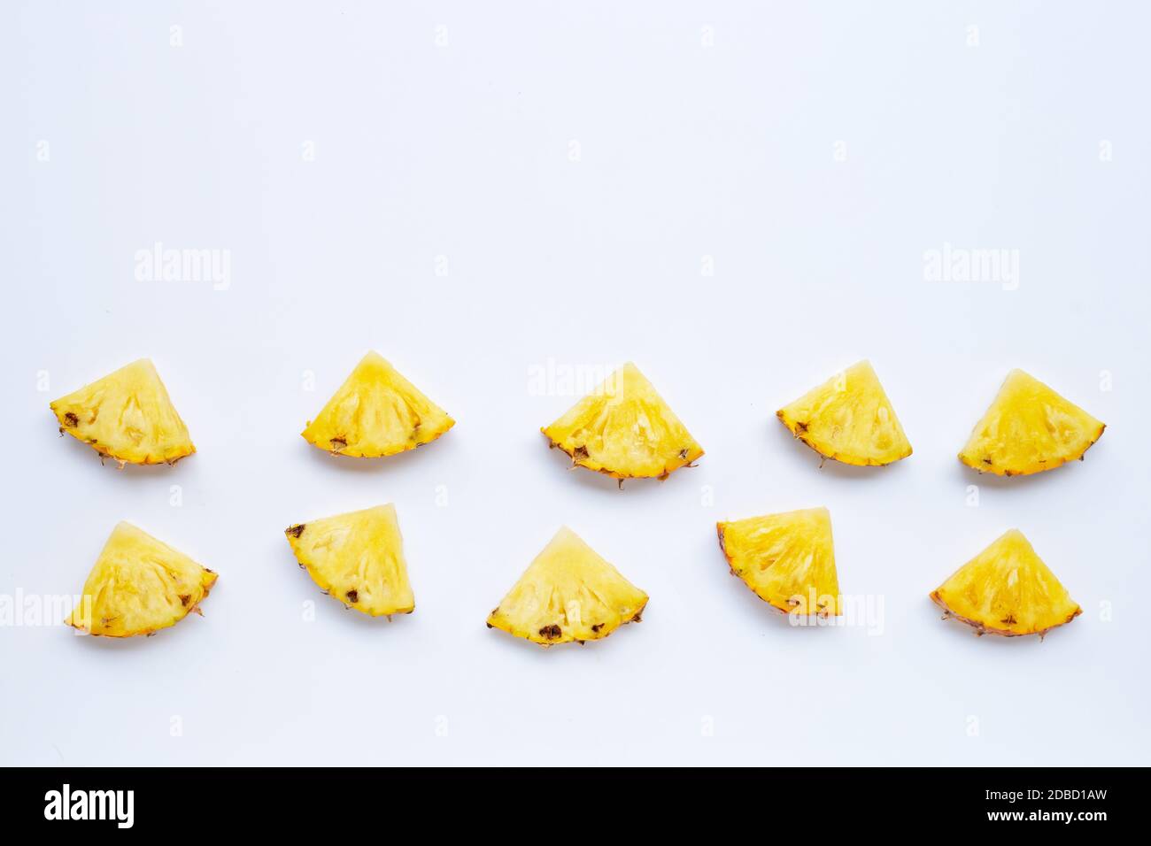 Pineapple slices on white background Stock Photo - Alamy