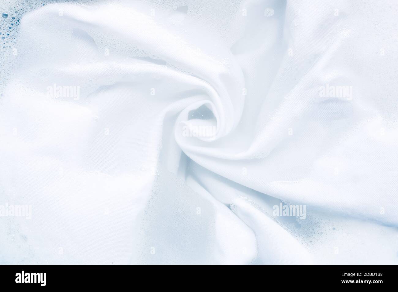 Soak a cloth before washing, white cloth. Top view Stock Photo - Alamy