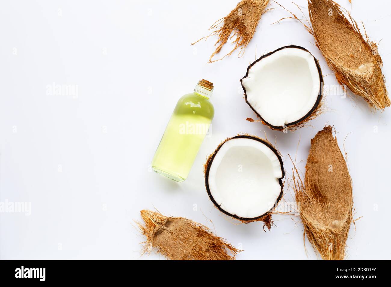 Coconut oil with coconuts on white background Stock Photo - Alamy