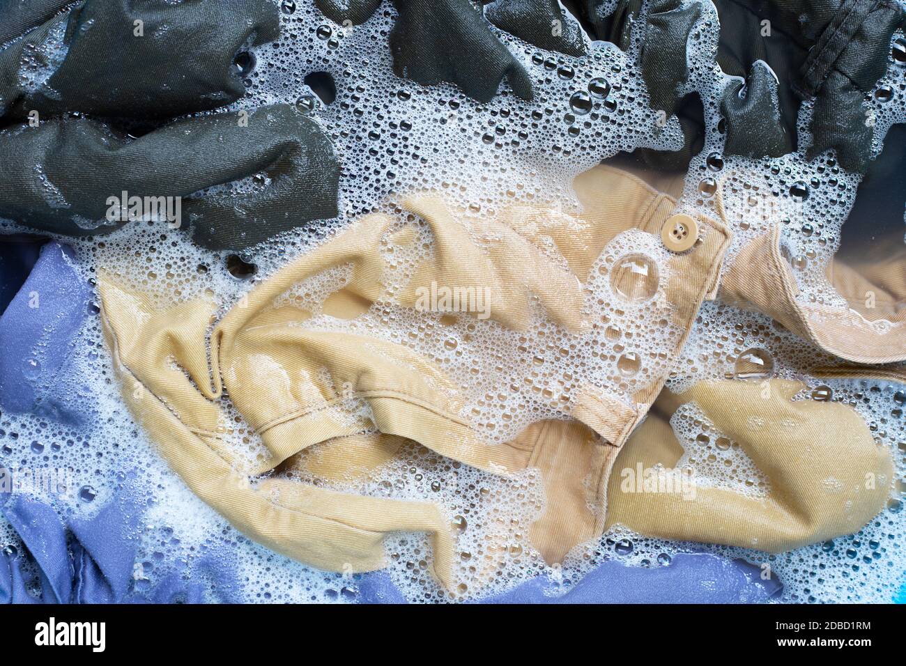 Trousers soak in powder detergent water dissolution, washing cloth ...