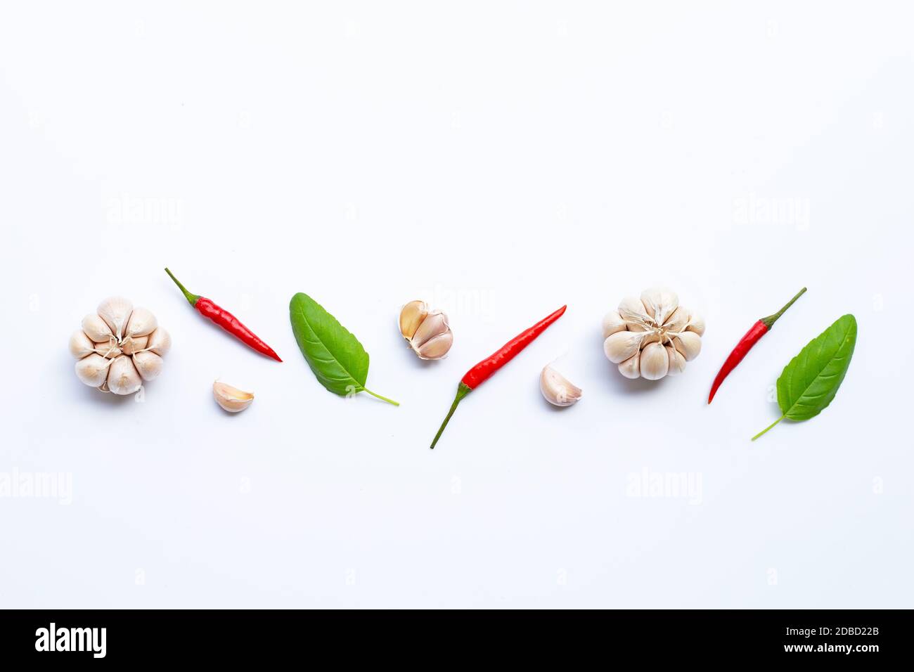Ingredients herb and spice, holy basil, chili and garlic on white ...