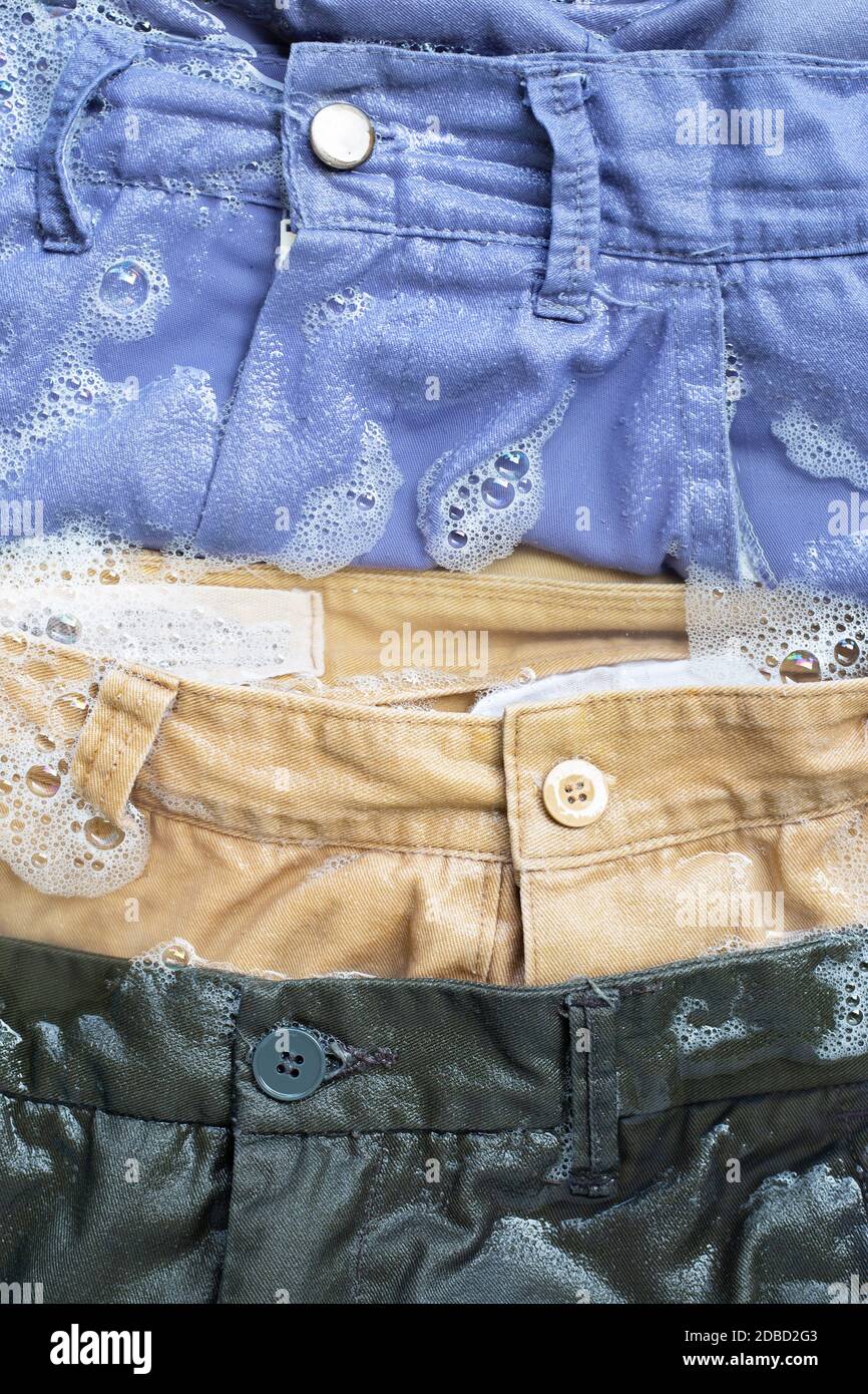 Trousers soak in powder detergent water dissolution, washing cloth ...