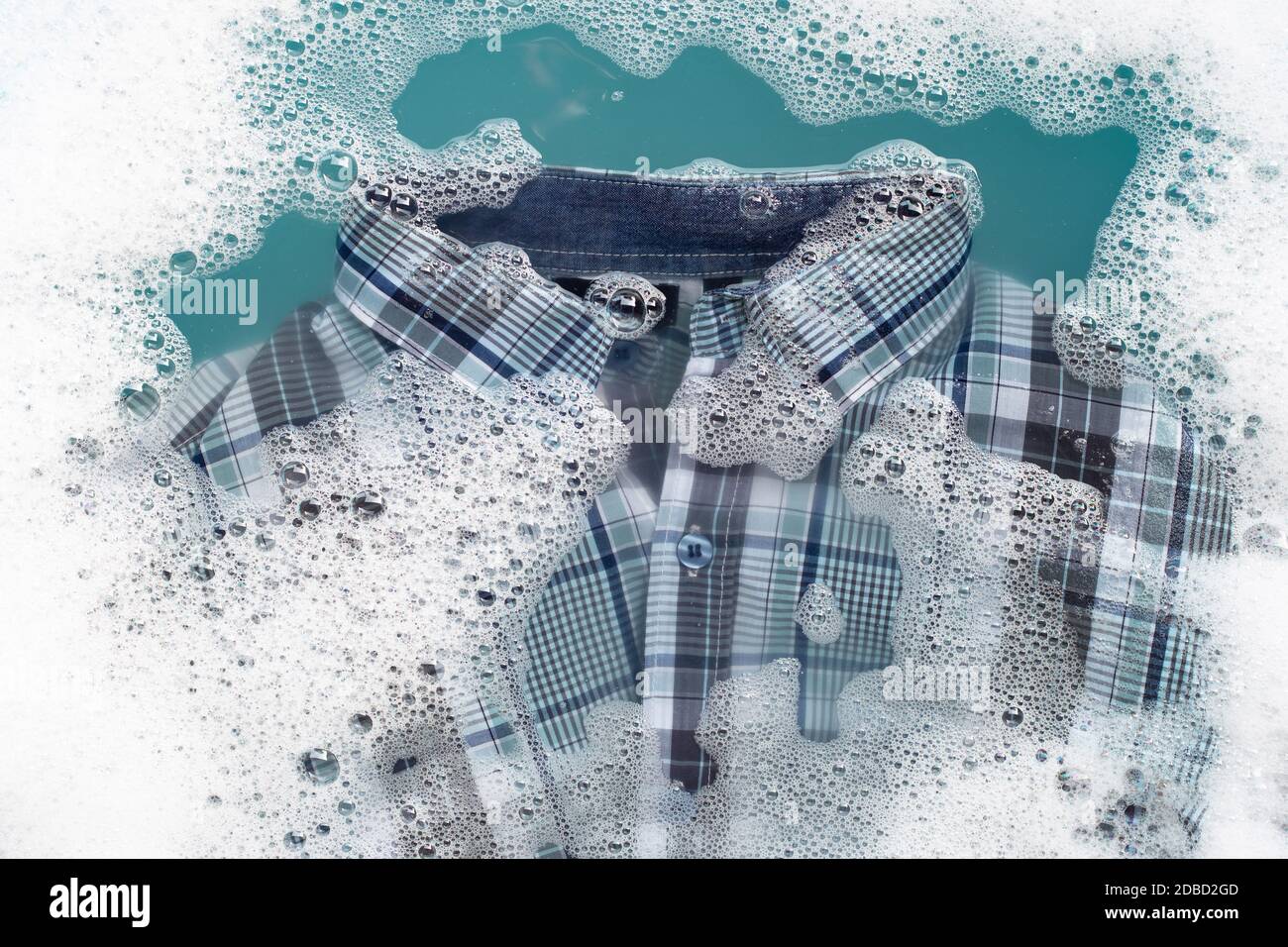 Shirt soak in powder detergent water dissolution, washing cloth ...