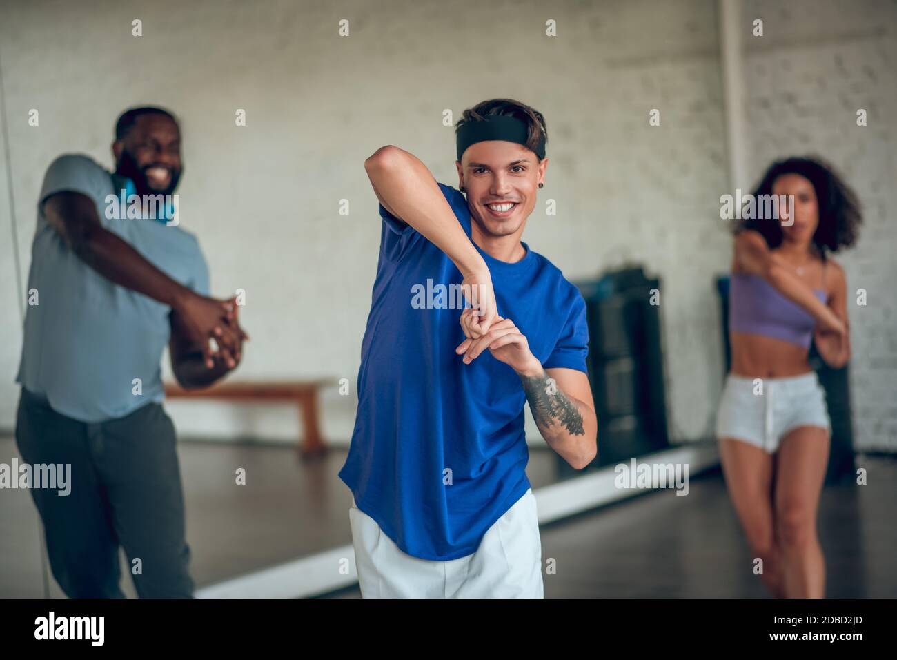 Teacher showing hip-hop routine to his students Stock Photo - Alamy
